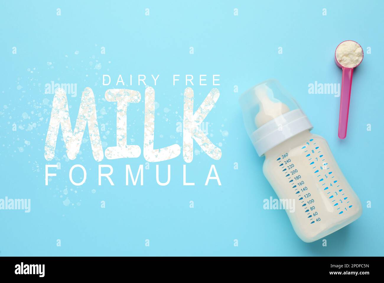 Feeding bottle with dairy free infant formula and powder on light blue ...