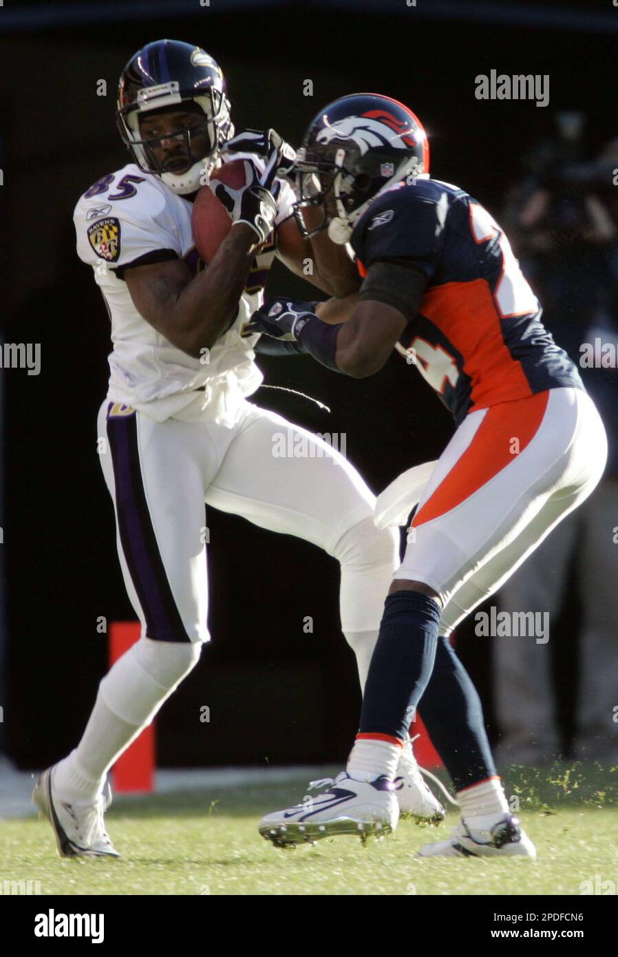 ** FILE ** Baltimore Ravens wide receiver Derrick Mason, left, pulls in ...