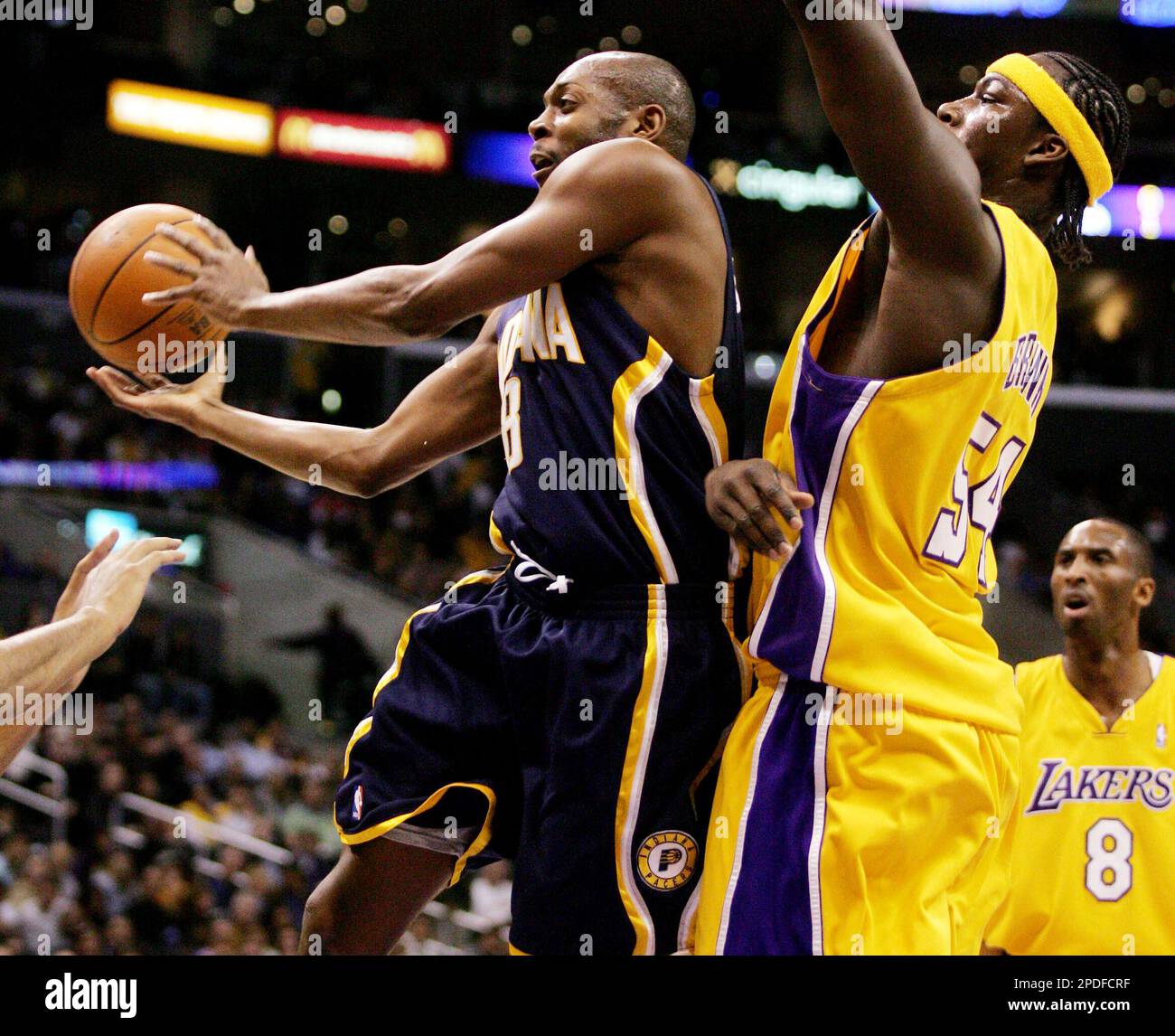 Indiana Pacers' Anthony Johnson looks to pass the ball as he jumps ...