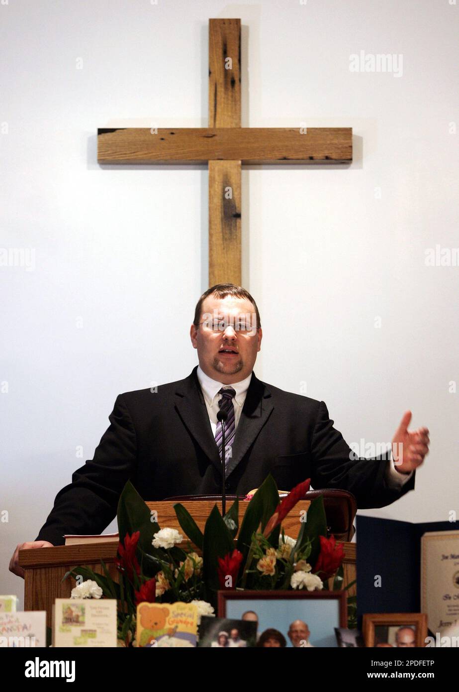 Pastor Chris Cosner leads the family and friends of Jerry Lee Groves ...