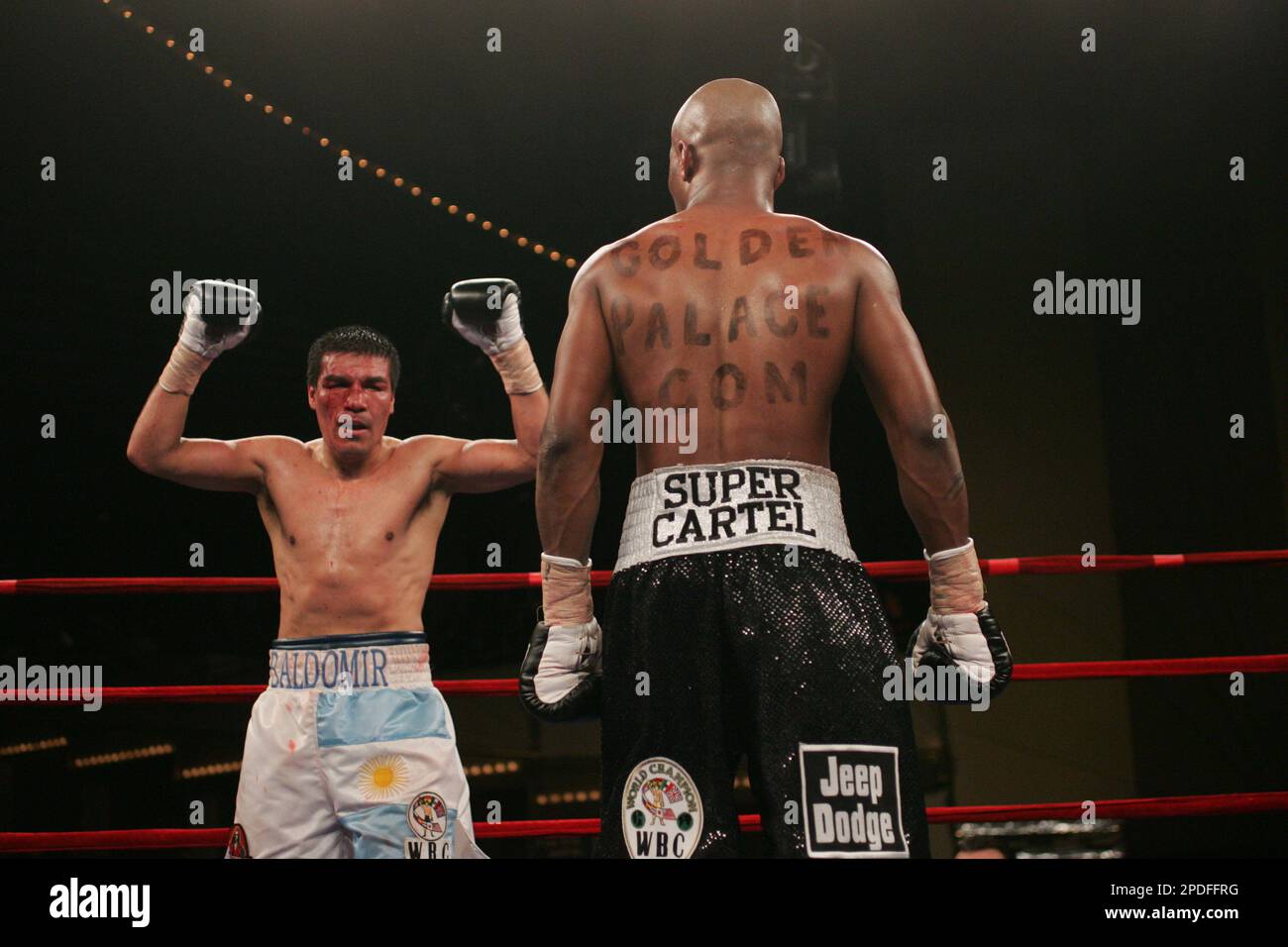 Welterweight boxer Carlos Baldomir, left, claims victory over Zab Judah ...