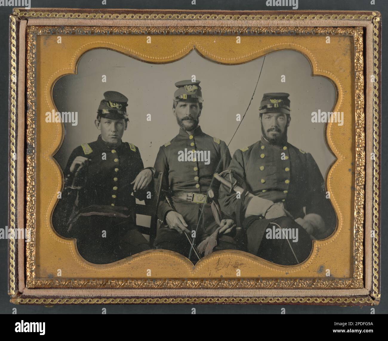 Three unidentified soldiers in Union uniforms with swords. Liljenquist Family Collection of ...