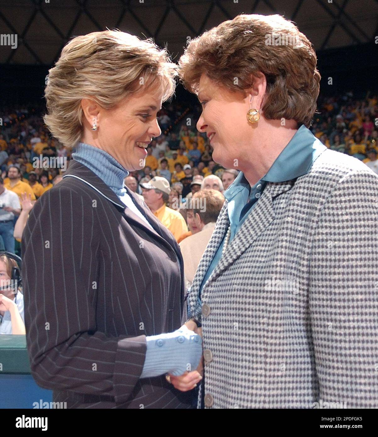 Baylor coach Kim Mulkey-Robertson, left, shakes hands with Texas coach ...