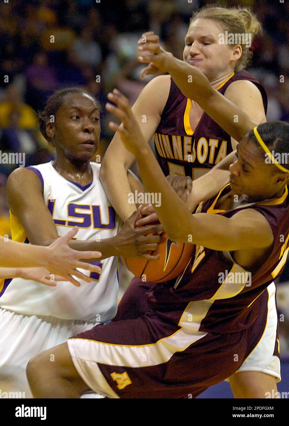 Louisiana State's Ashley Thomas, left, gets tangled up with Minnesota's ...