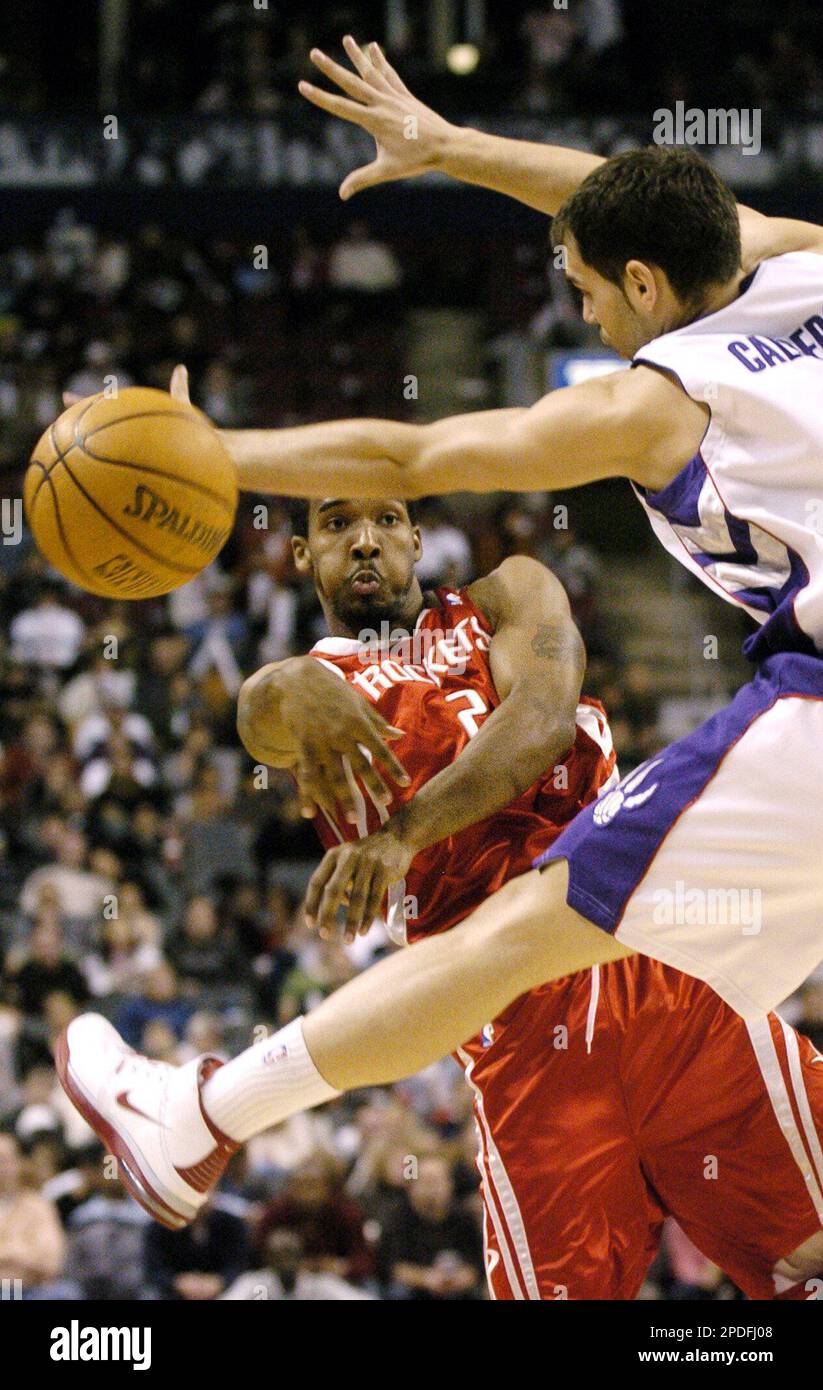 Toronto Raptors' Jose Calderon, right, tries to block a pass by Houston ...