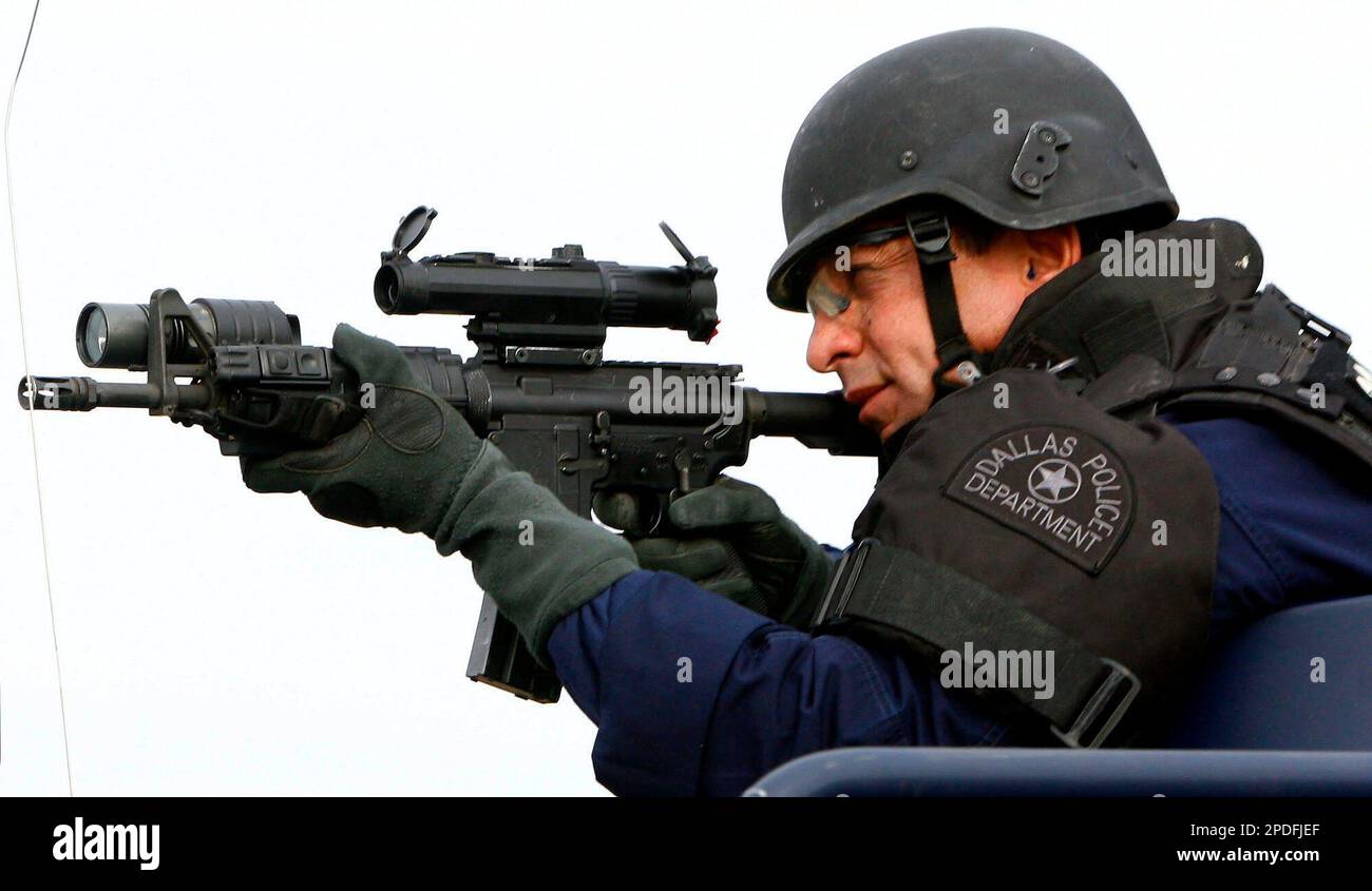 Dallas SWAT Police Officer J.D. Byas aquires a target during a tactical ...