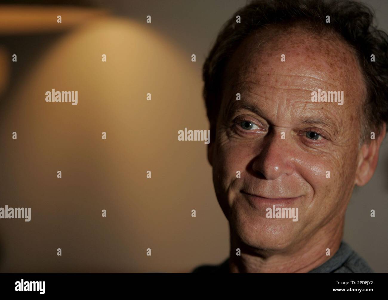 Author and photographer Jerry Friedman poses in his mother's apartment ...