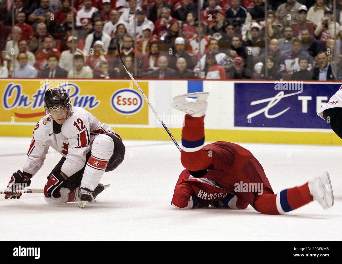 Team Canada's Kristopher Letang, left, looks back at Team Russia's ...