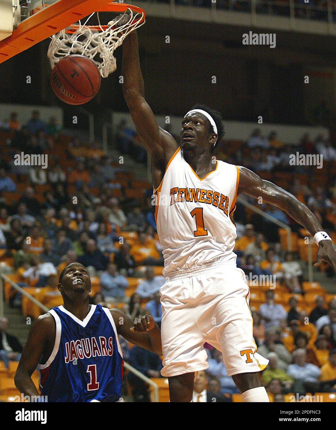 Tennessee's Major Wingate (1) dunks over South Alabama's Michael ...