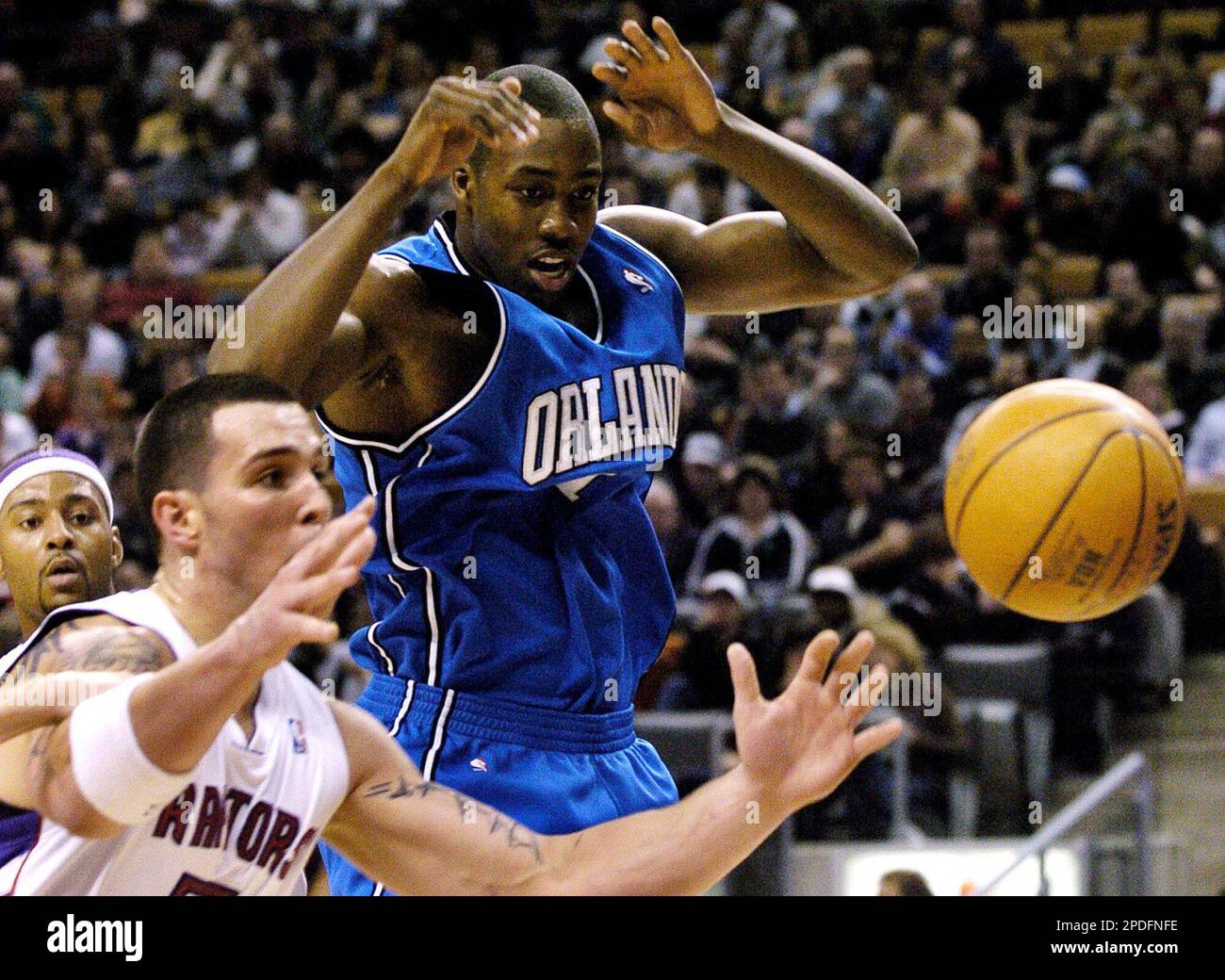 Orlando Magic Dwight Howard, top, looks on as Toronto Raptors Rafael ...