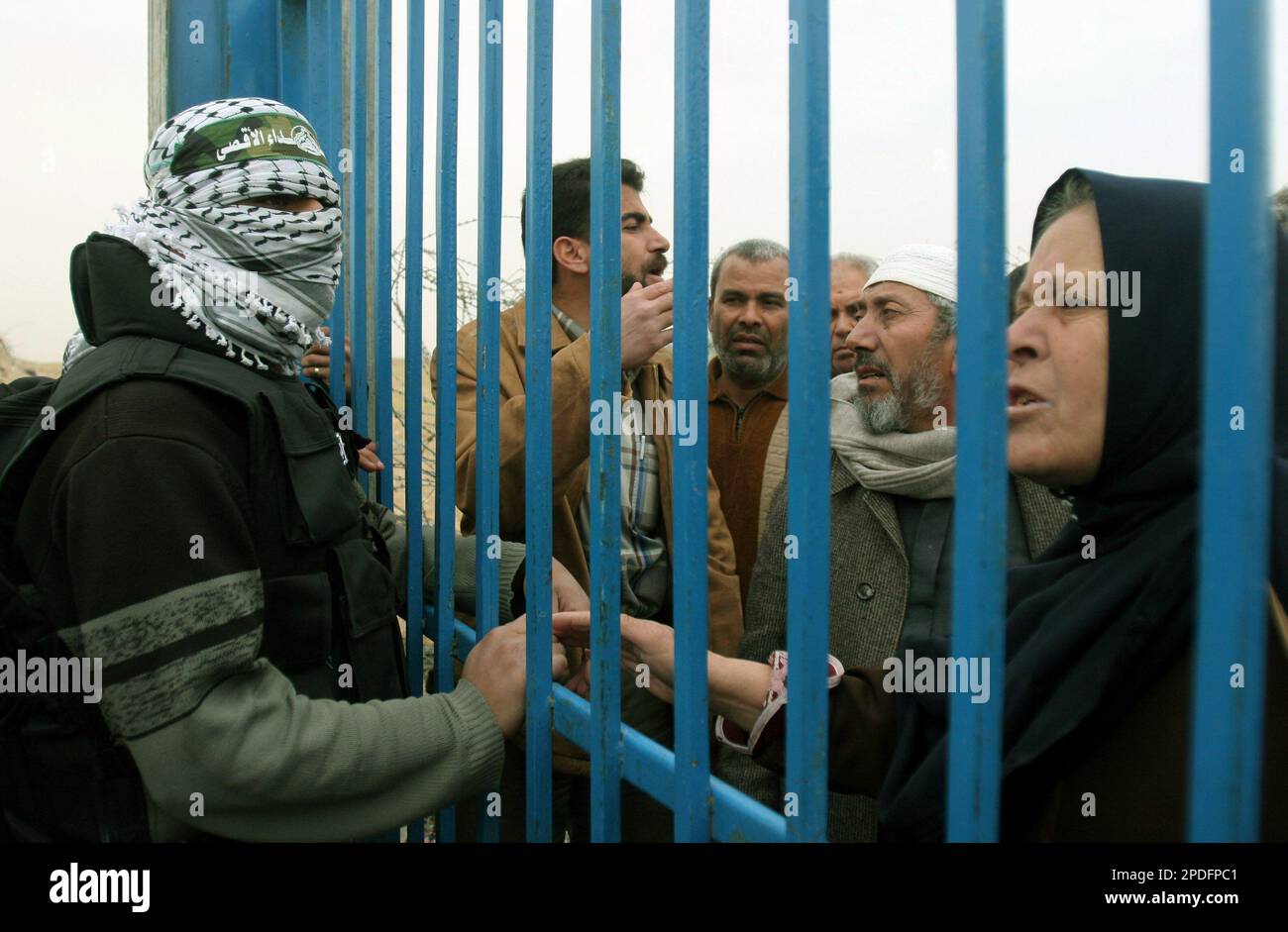 A masked militant of the Al Aqsa Martyrs' Brigades, an offshoot of ...