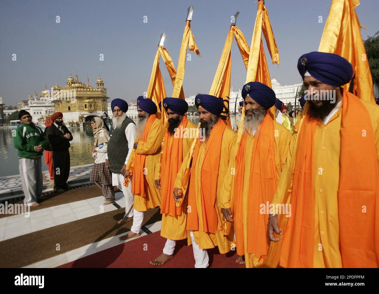 Baptised Sikhs lead a religious procession to celebrate the birth ...