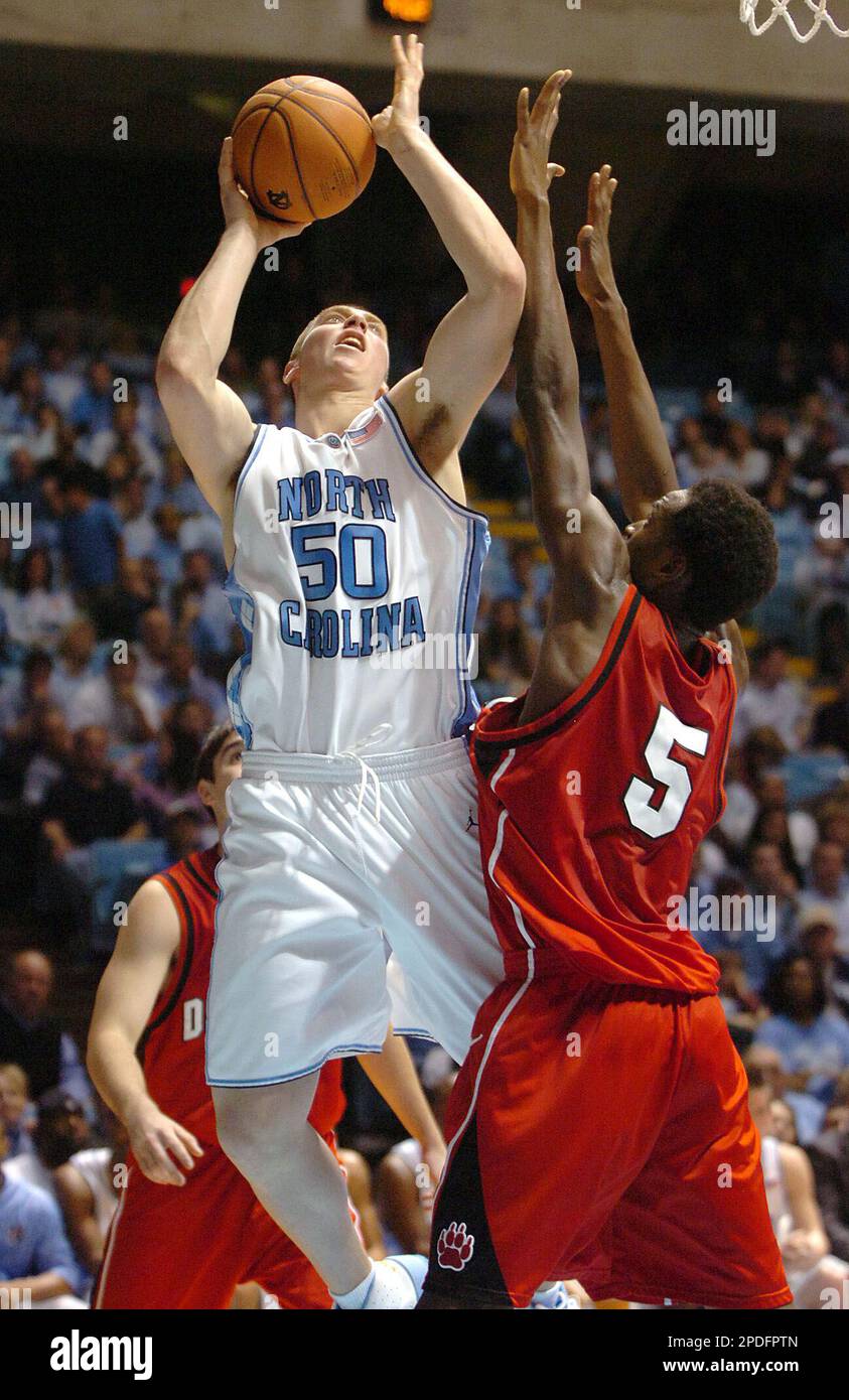 North Carolina's Tyler Hansbrough (50), left, puts up a shot against ...