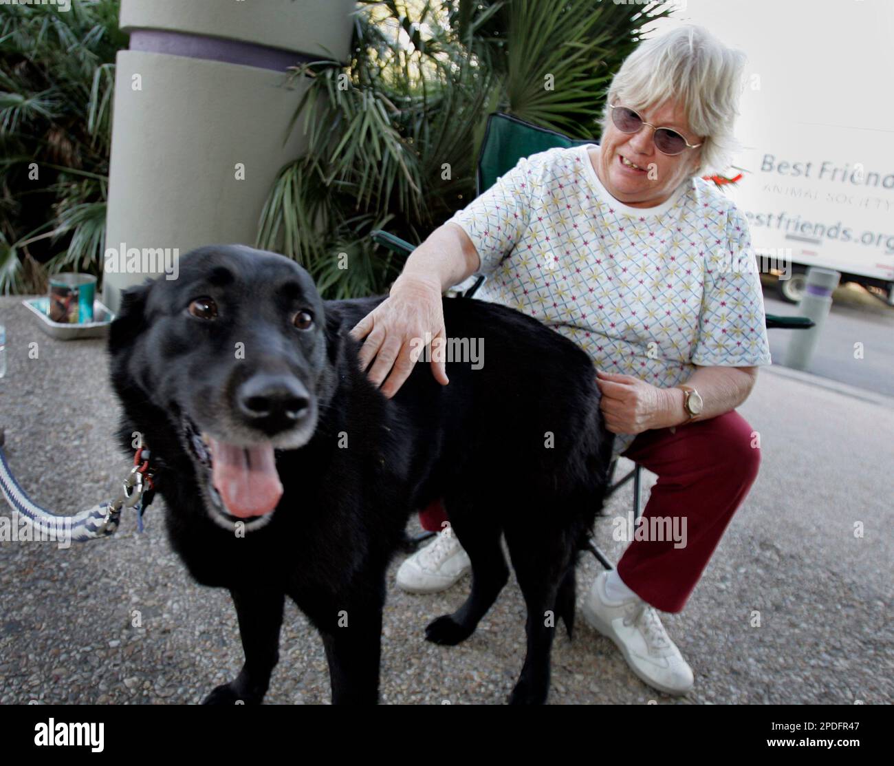 Lynette Tobin, of Metarie, La., pets her dog, Sadie, as the dog was ...