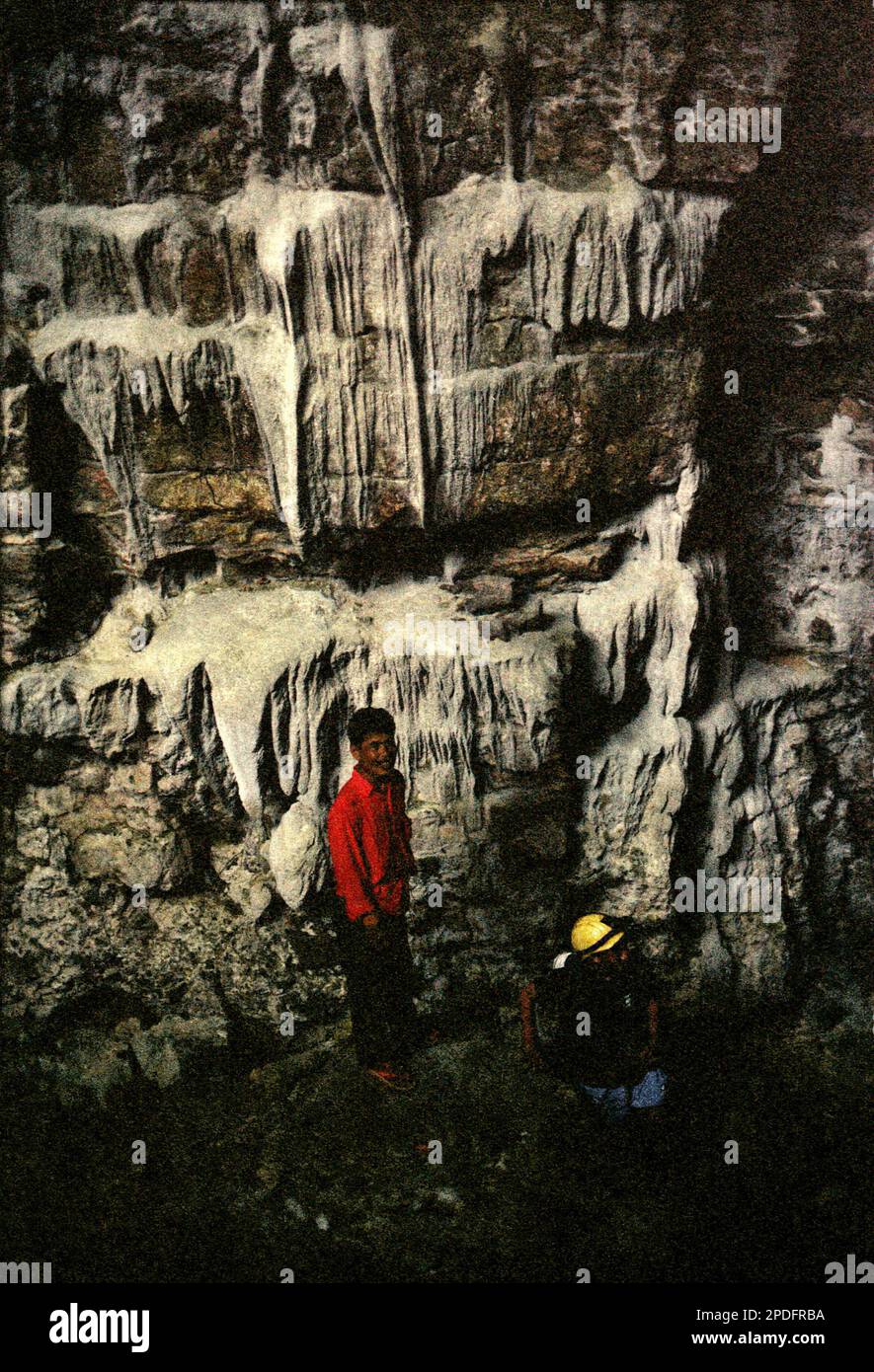 A villager and a speleology enthusiast are standing in front of an ...