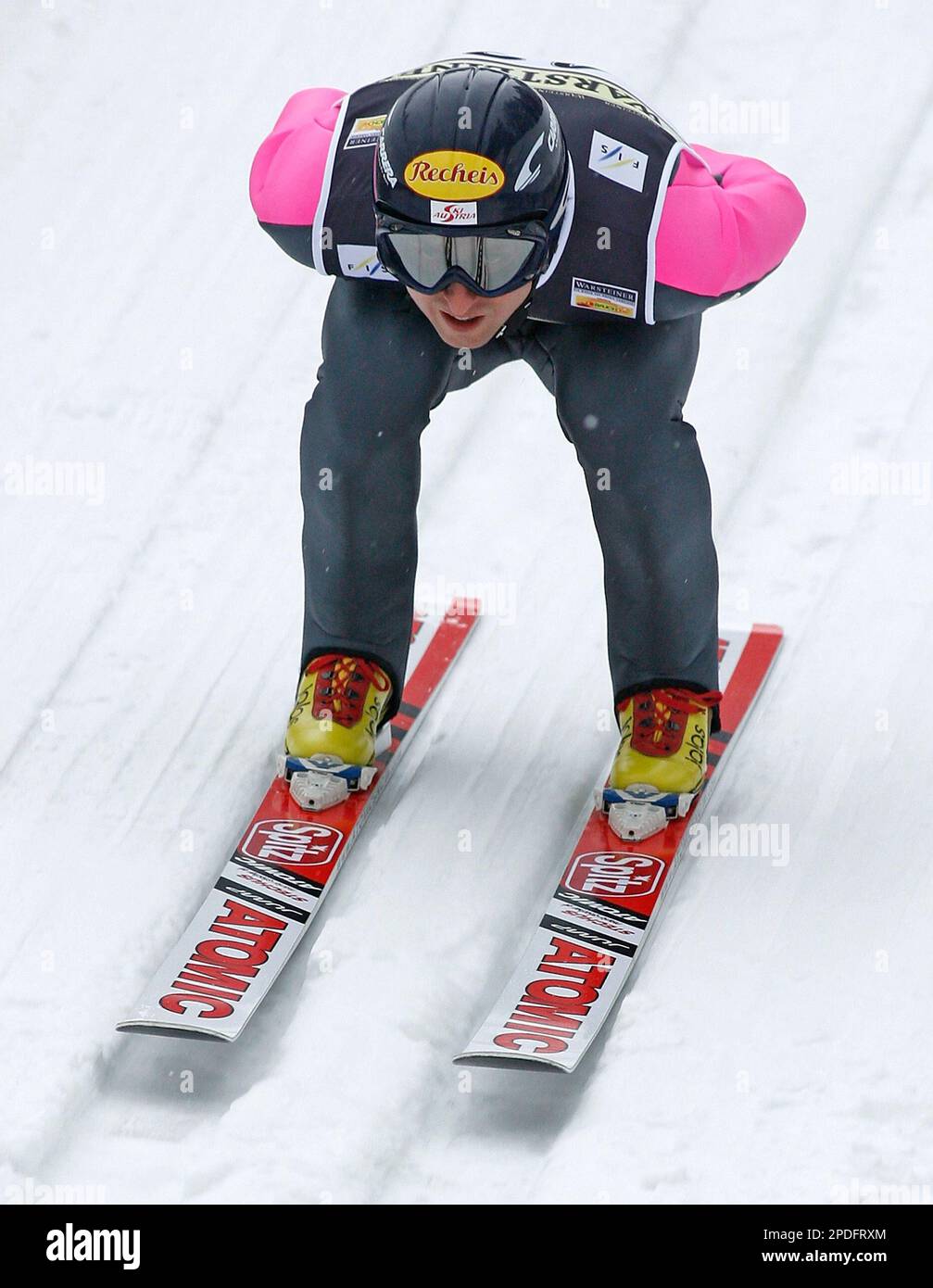 Mario Stecher from Austria speeds down the jumping hill during the ...