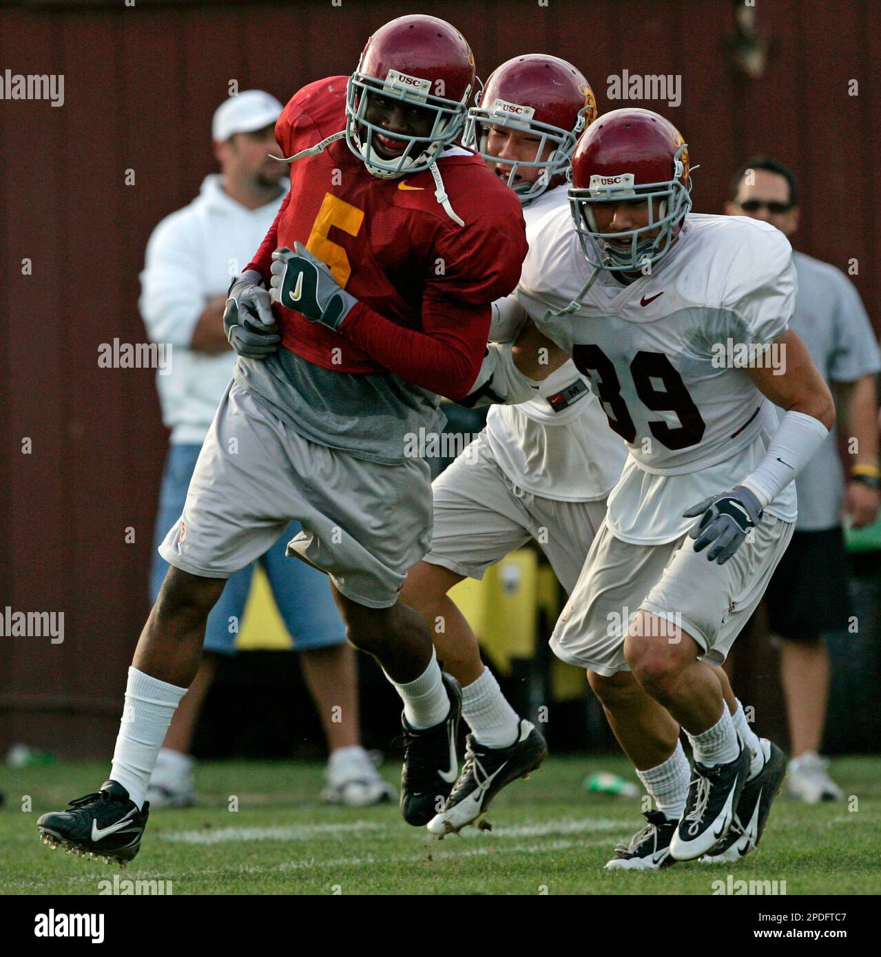 Southern California's Brandon Ting, center, and his brother Ryan Ting ...