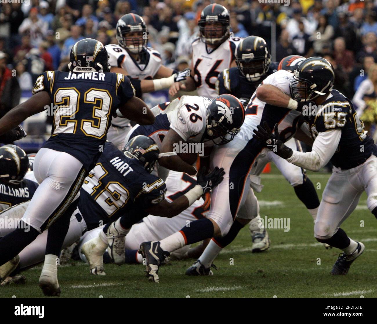 Denver Broncos running back Tatum Bell (26) breaks through the tackle ...