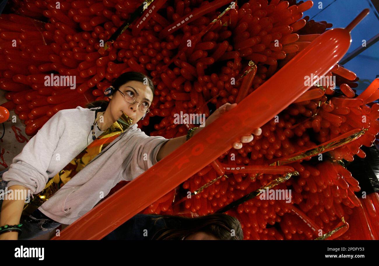 Emma Henriksen, 17, of Wisconsin, inflates balloons in New York's Times ...