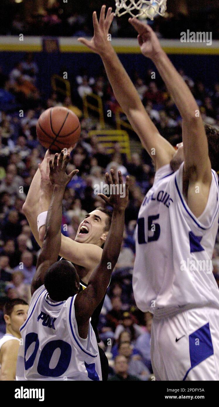 Iowa's Jeff Horner shoots over Saint Louis' Dwayne Polk (00) and Ian ...