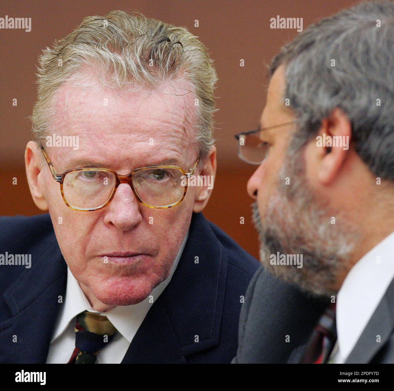 James Sullivan, 64, left, confers with attorney Don Samuel, right ...
