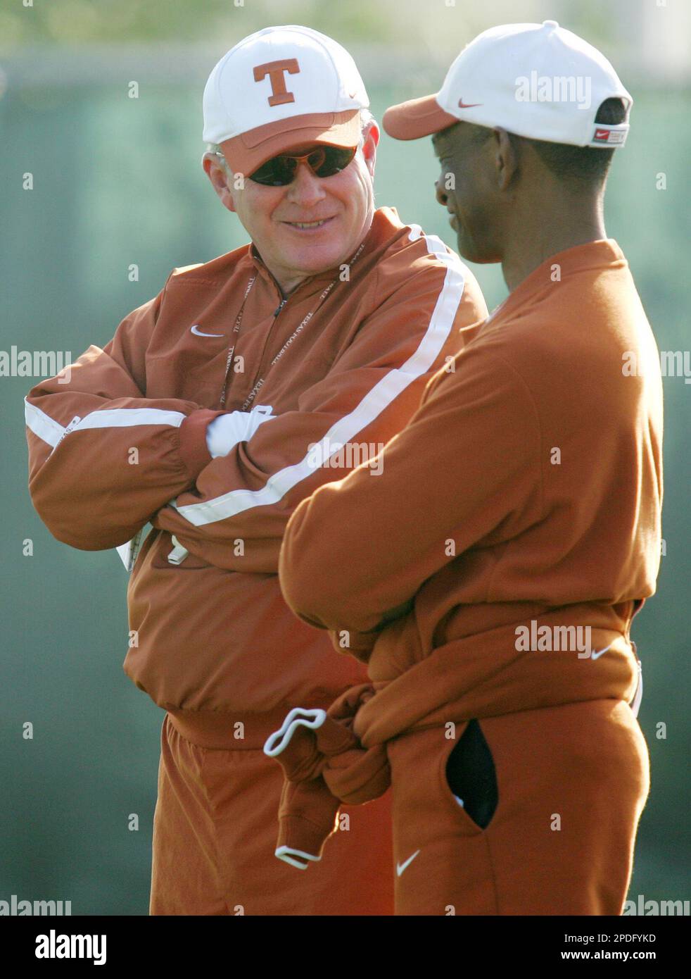 Texas coach Mack Brown, left, talks with Cleve Bryant, associate ...