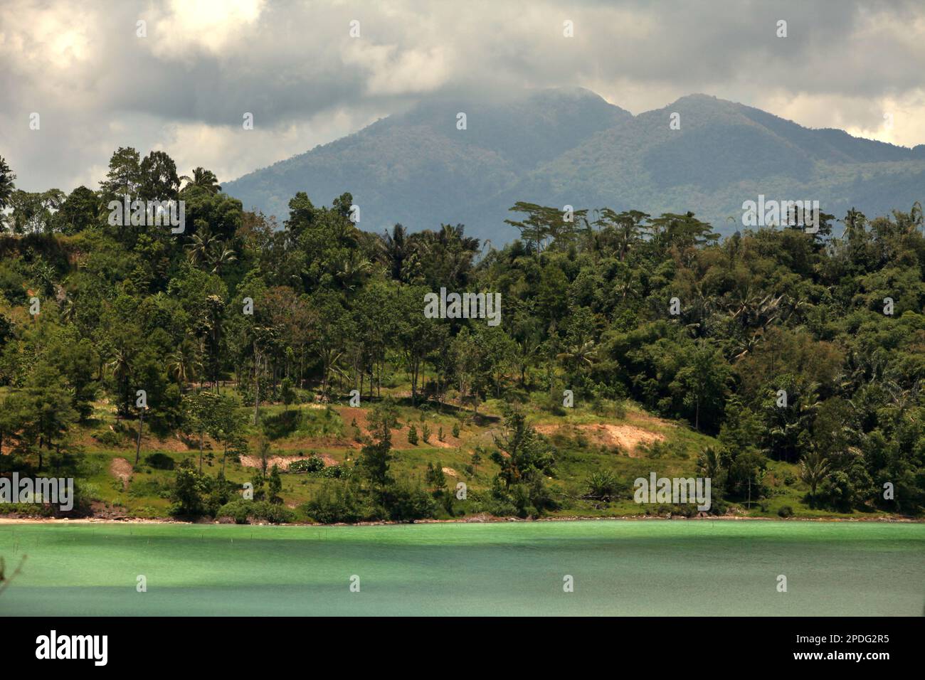 A view of Lake Linow, a volcanic lake, in a background of Mount Empung ...