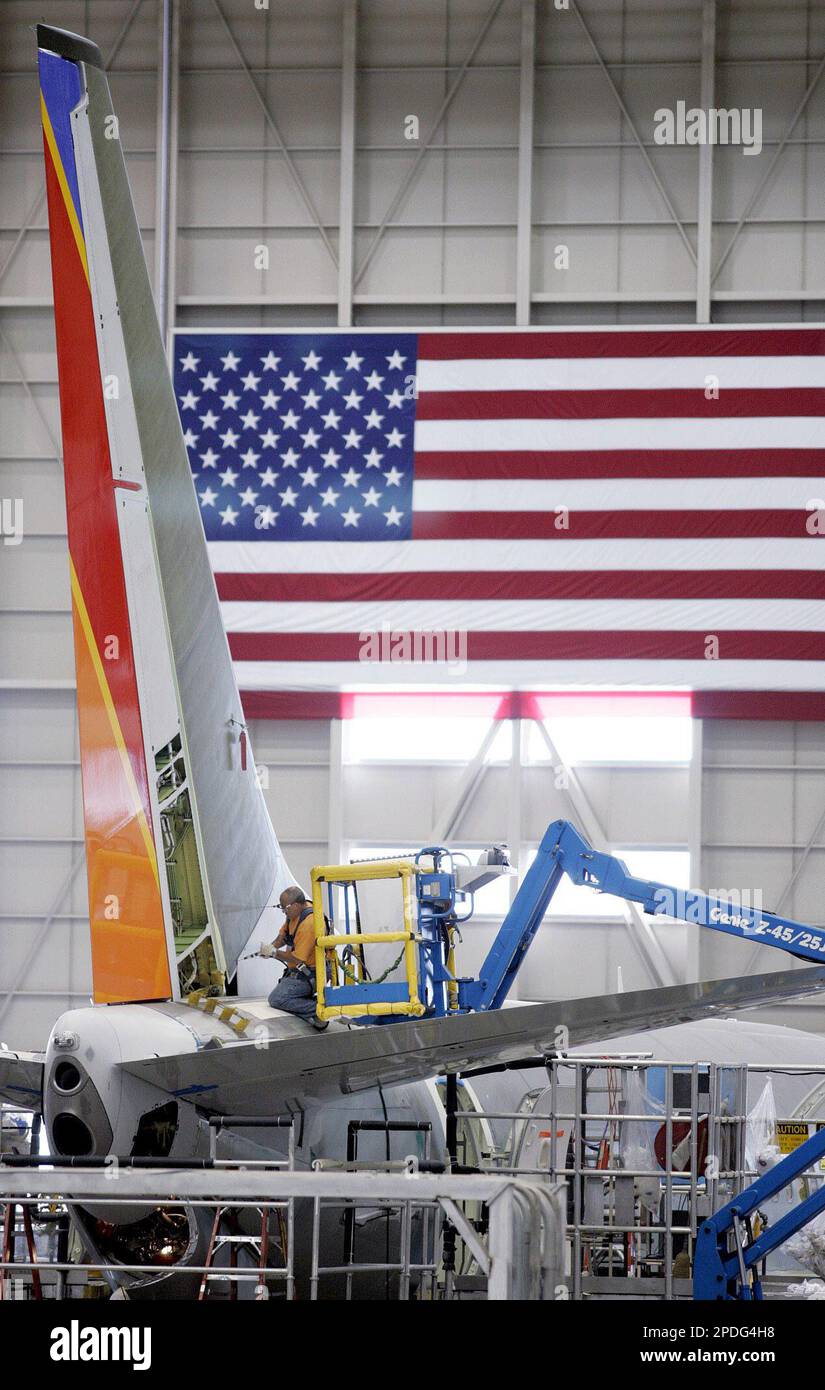 ** FILE ** A worker at the Boeing Co.'s Renton, Wash. assembly plant ...