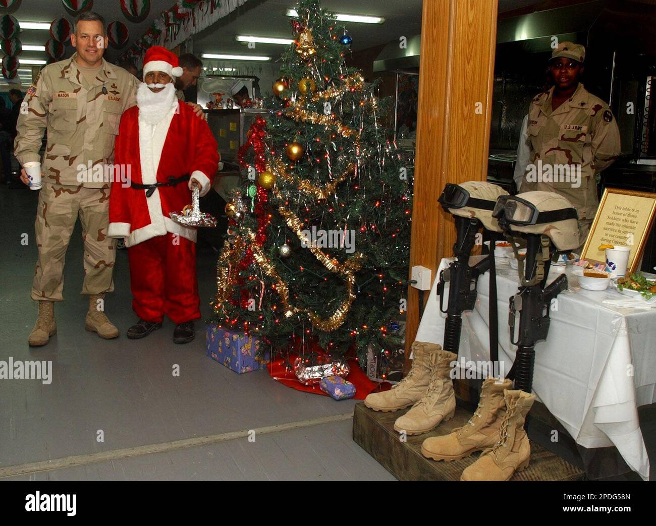 US soldier Ray Mason, left, from Alexandria, Va, stands with an ...