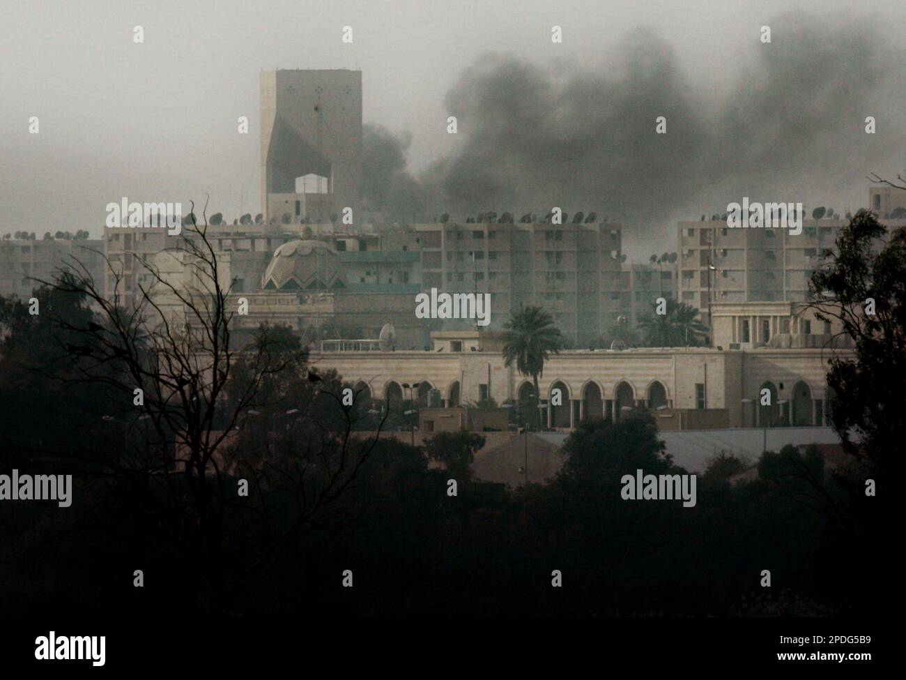 Smoke rises from a housing complex in Baghdad, Iraq, Sunday Dec. 25 ...