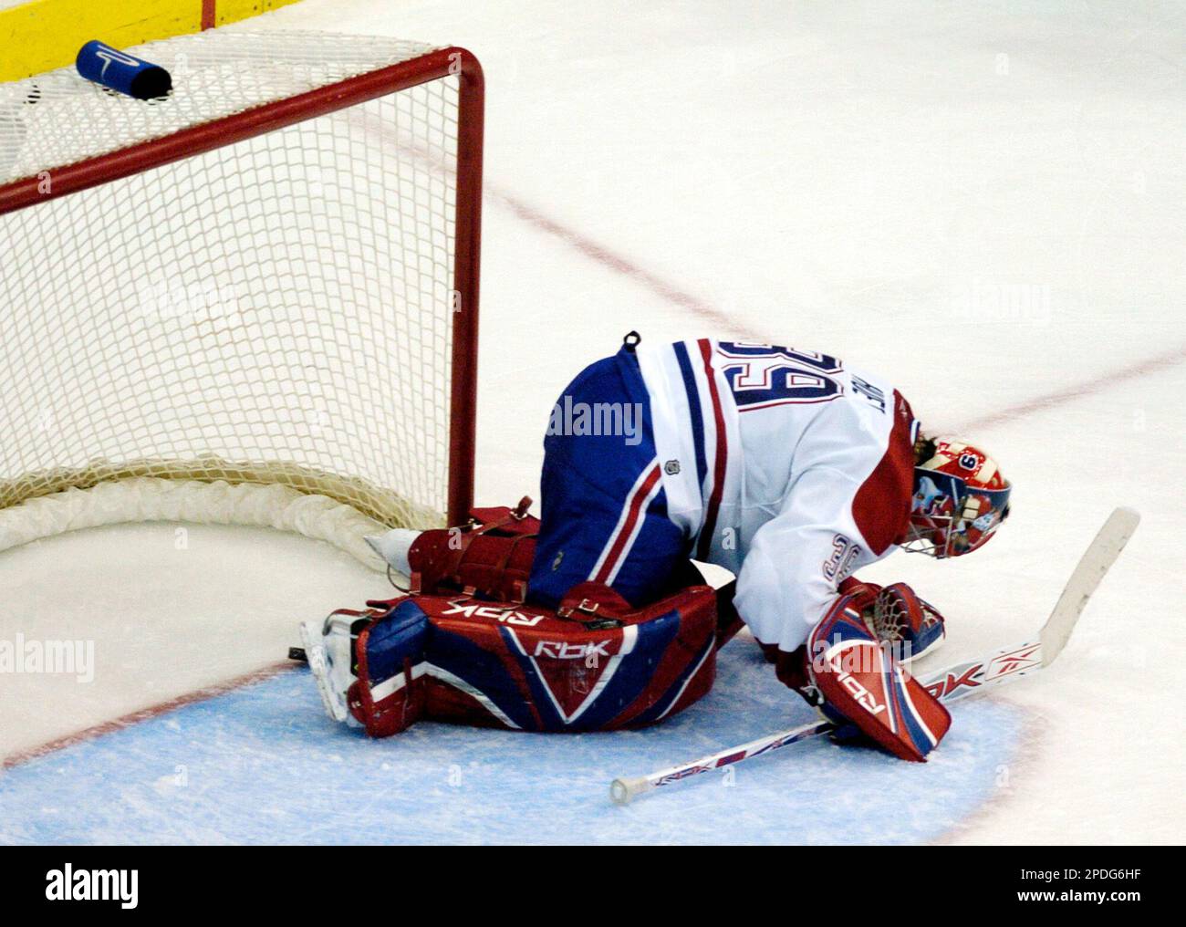 Montreal Canadiens goalie Cristobal Huet (39), of France, hunches over ...