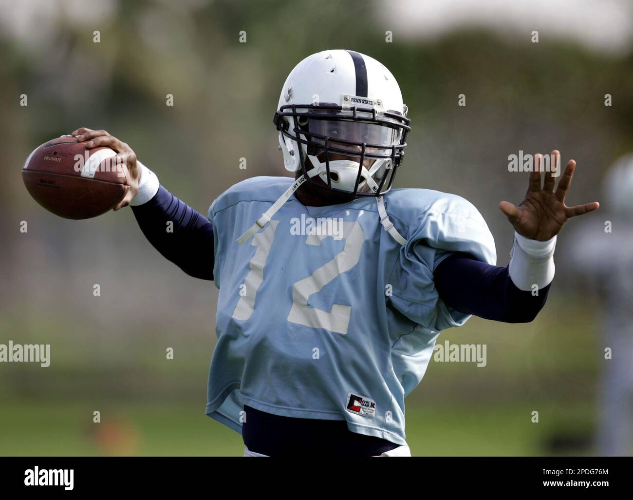 Penn State quarterback Michael Robinson warms up before practice Friday ...