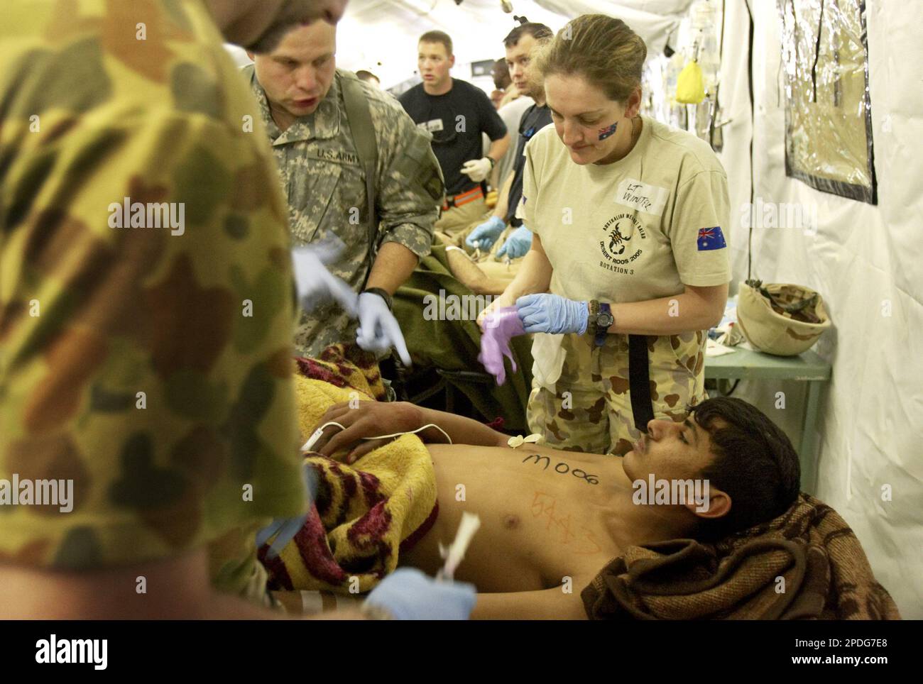 Australian Army nurse, Lt. Sarah Winter, of Sydney, Australia, prepares ...