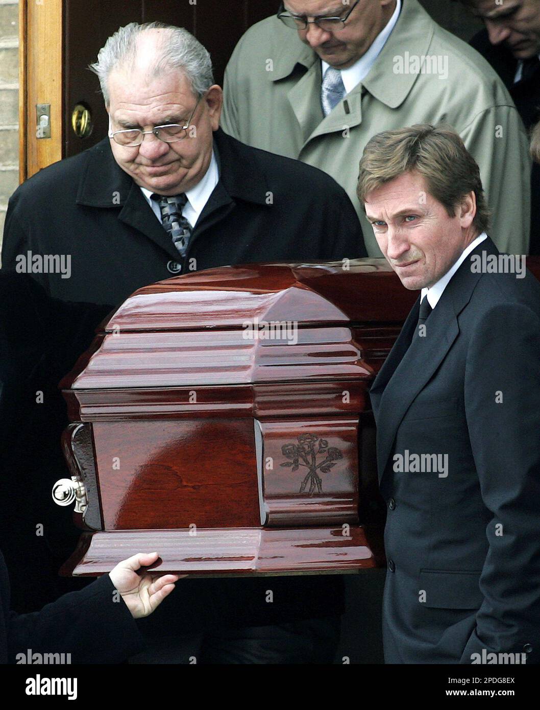 Wayne Gretzky carries the casket of his mother Phyllis Gretzky during a ...