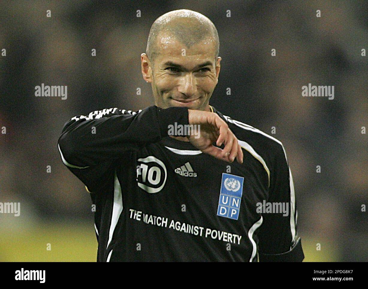 French soccer player Zinedine Zidane is all smiles during the charity ...