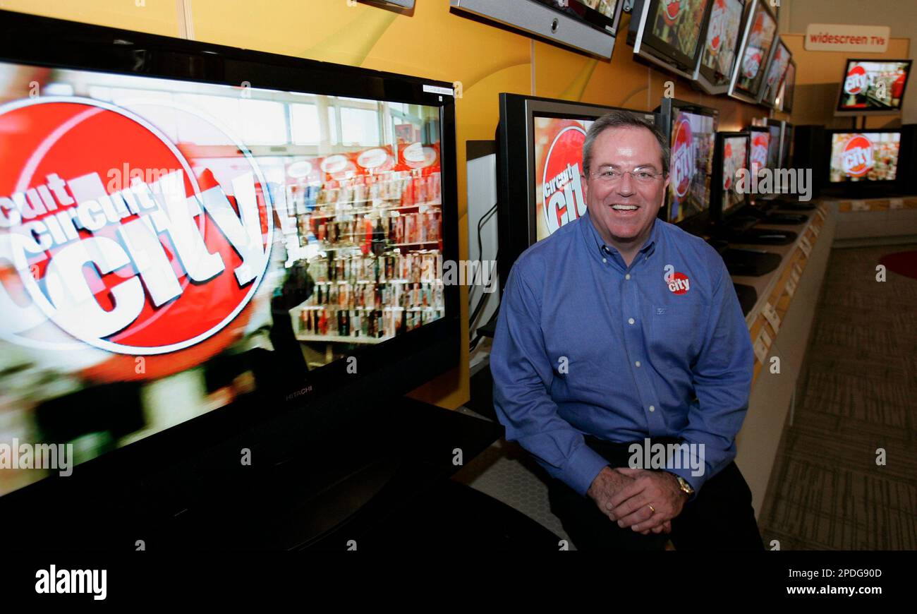 Circuit City president, Philip J. Schoonover, poses in front of a ...