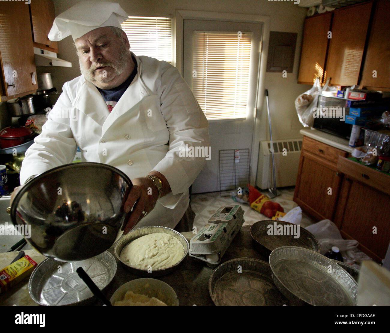 New Orleans chef Daniel Dyer, 61, prepares cakes in the kitchen of a ...