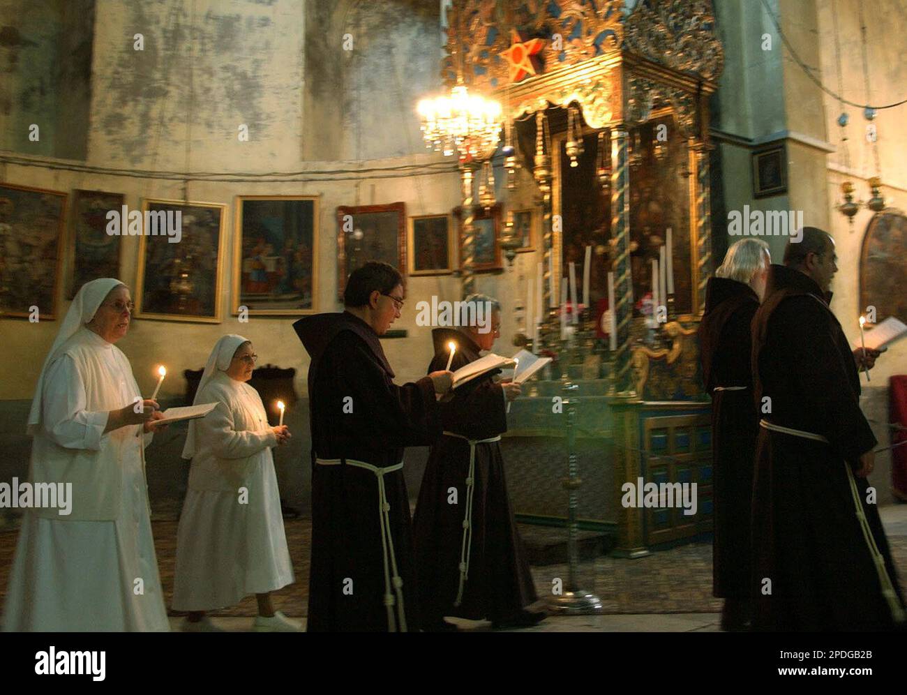 Franciscan monks and nuns participate in a procession in the Church of ...