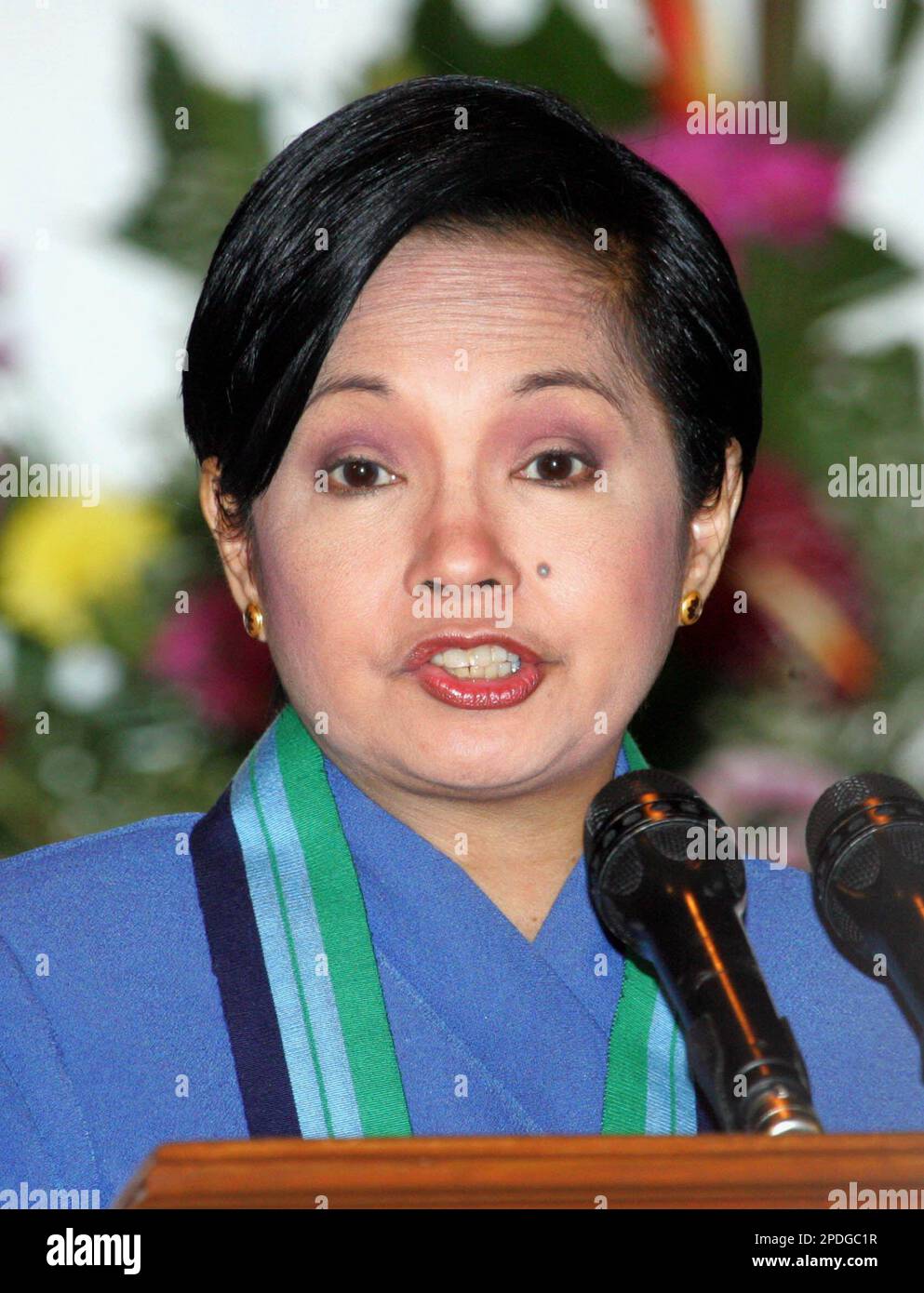 Philippine President Gloria Macapagal Arroyo delivers her message ...
