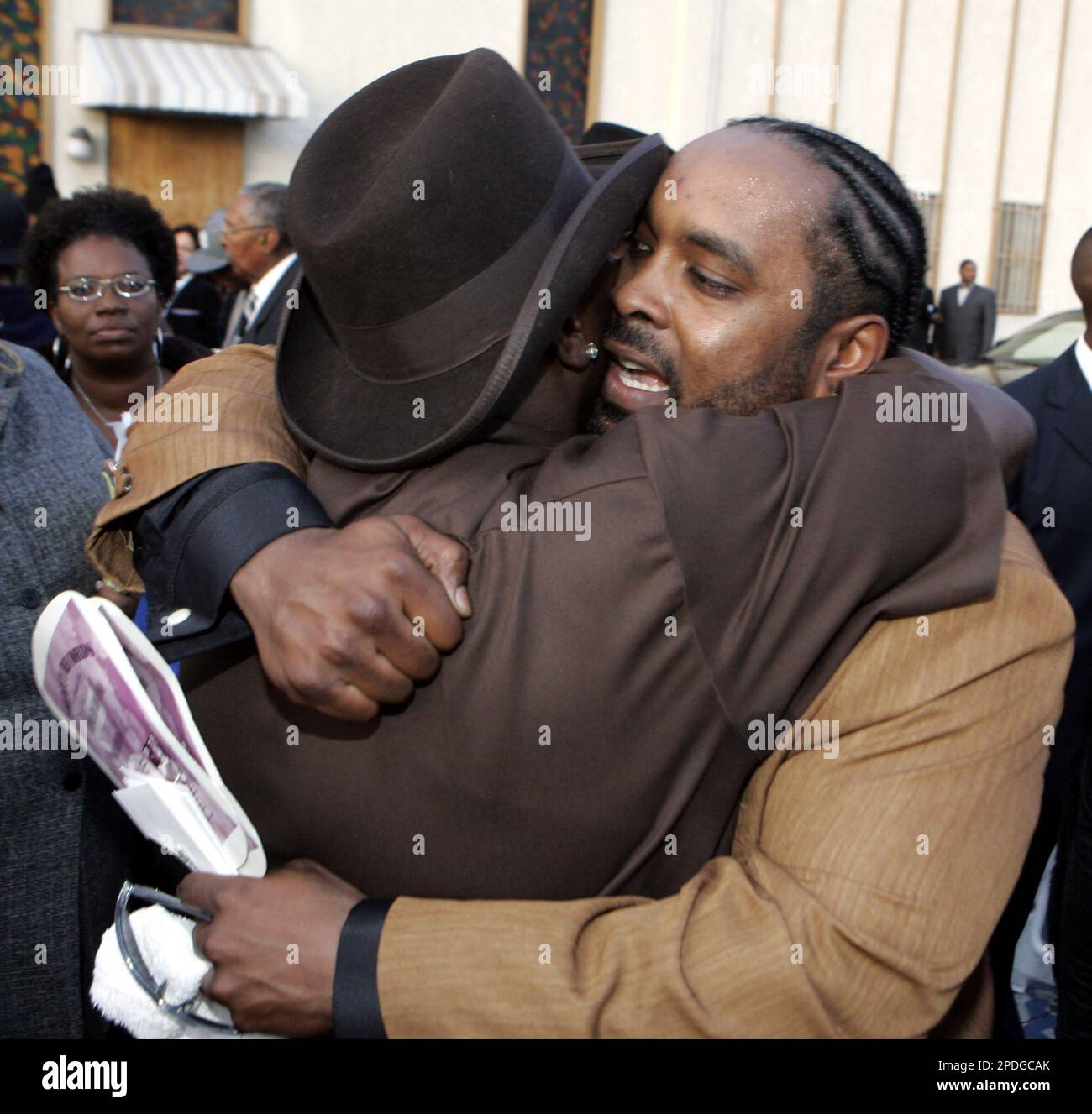 Travon Williams, right, son of Stanley "Tookie" Williams gets a hug ...