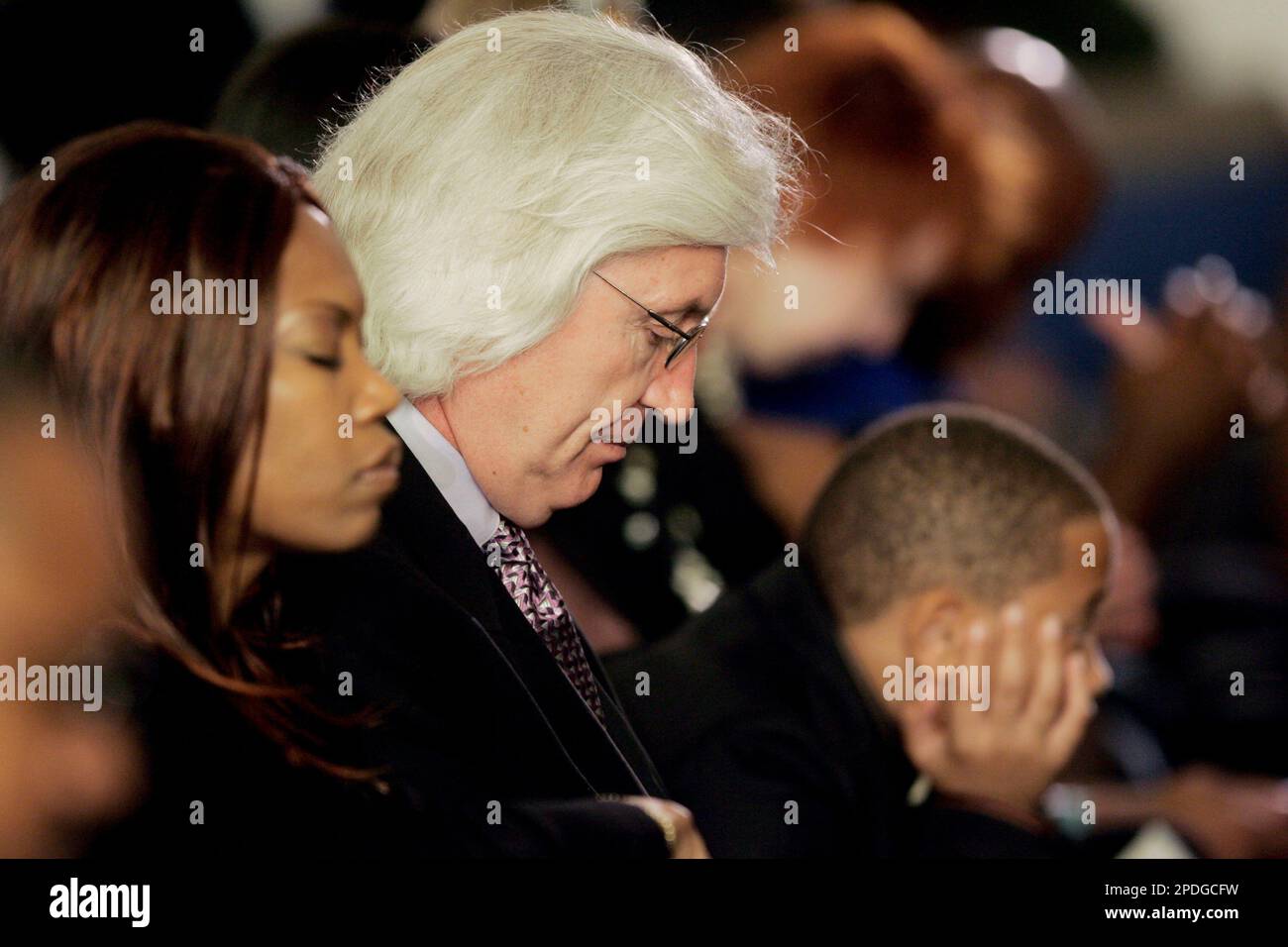 Lawyer Tom Mesereau, Jr., center, and Minnie Fox, left, join in during ...