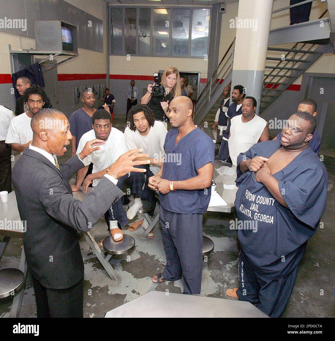 ** FILE ** John Gibson, left, speaks to prisoners at the Fulton County ...