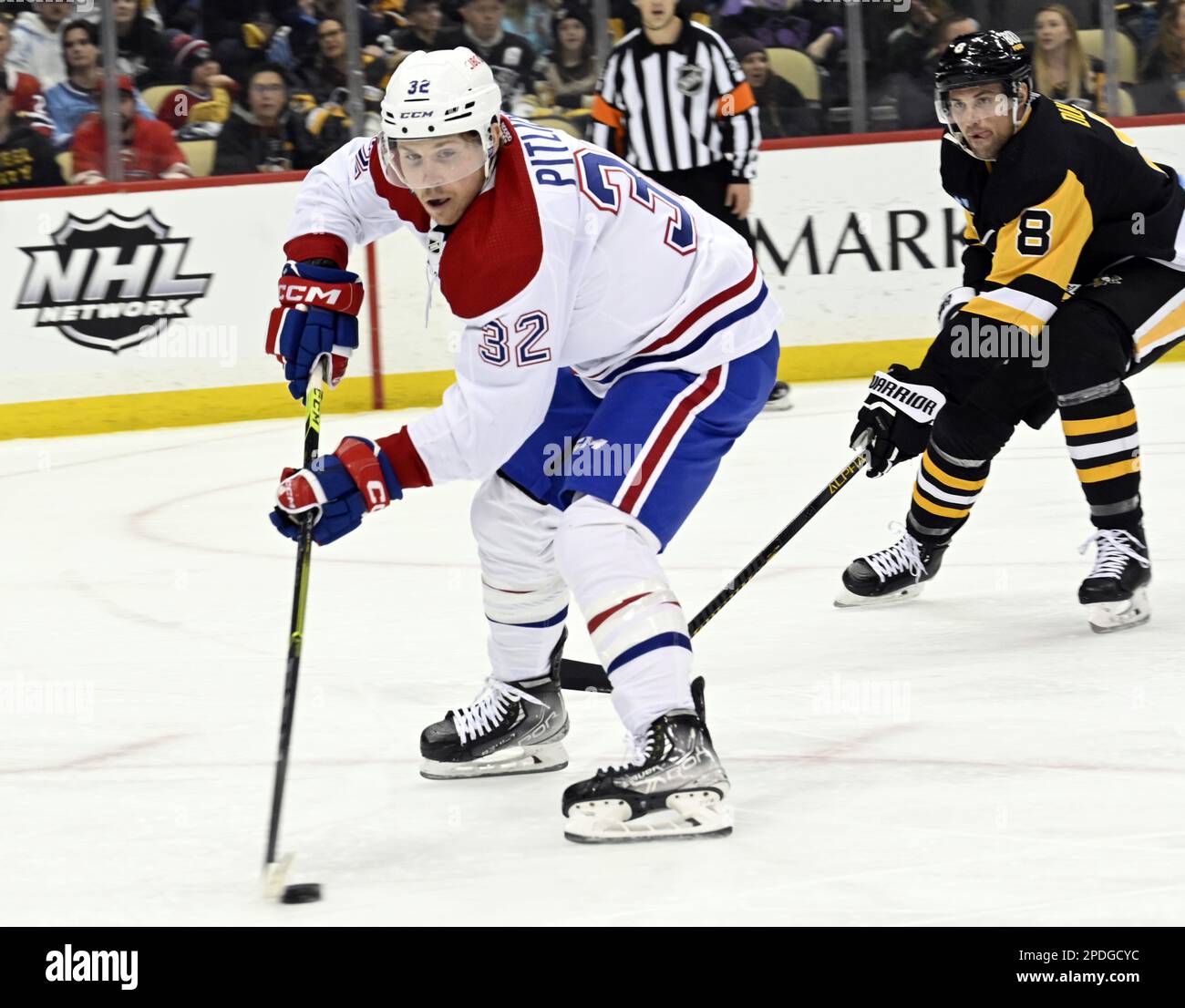 Montreal Canadiens left wing Mike Hoffman (68) passes the puck to ...