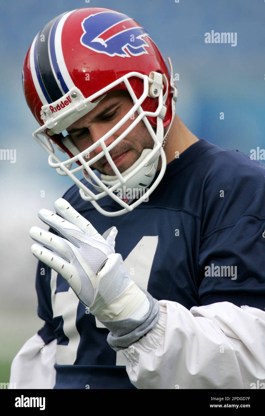 Buffalo Bills' Aaron Schobel looks at his hand during NFL football ...