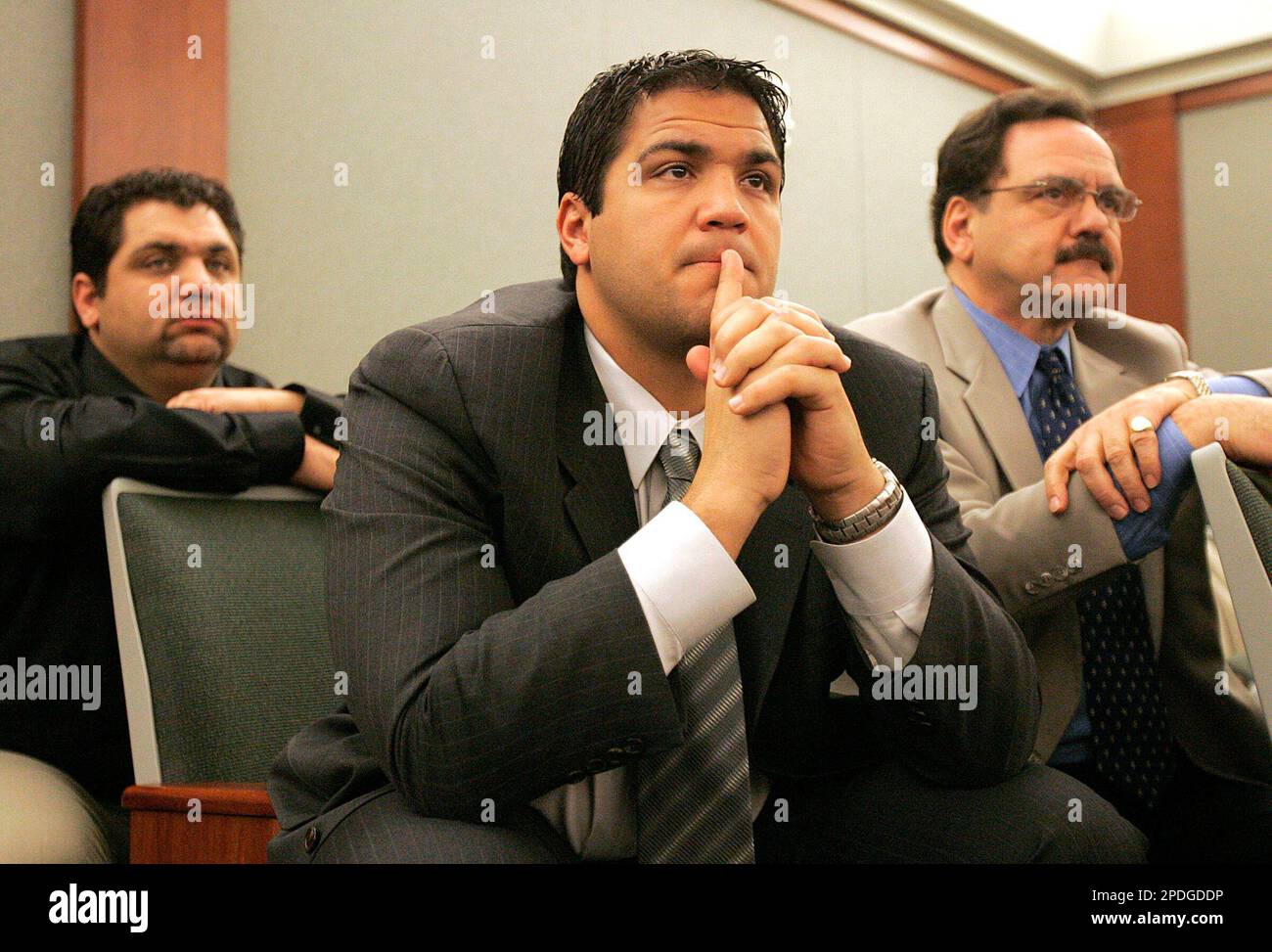 Boxer Joe Mesi, center, appears in a courtroom with his father Jack and ...