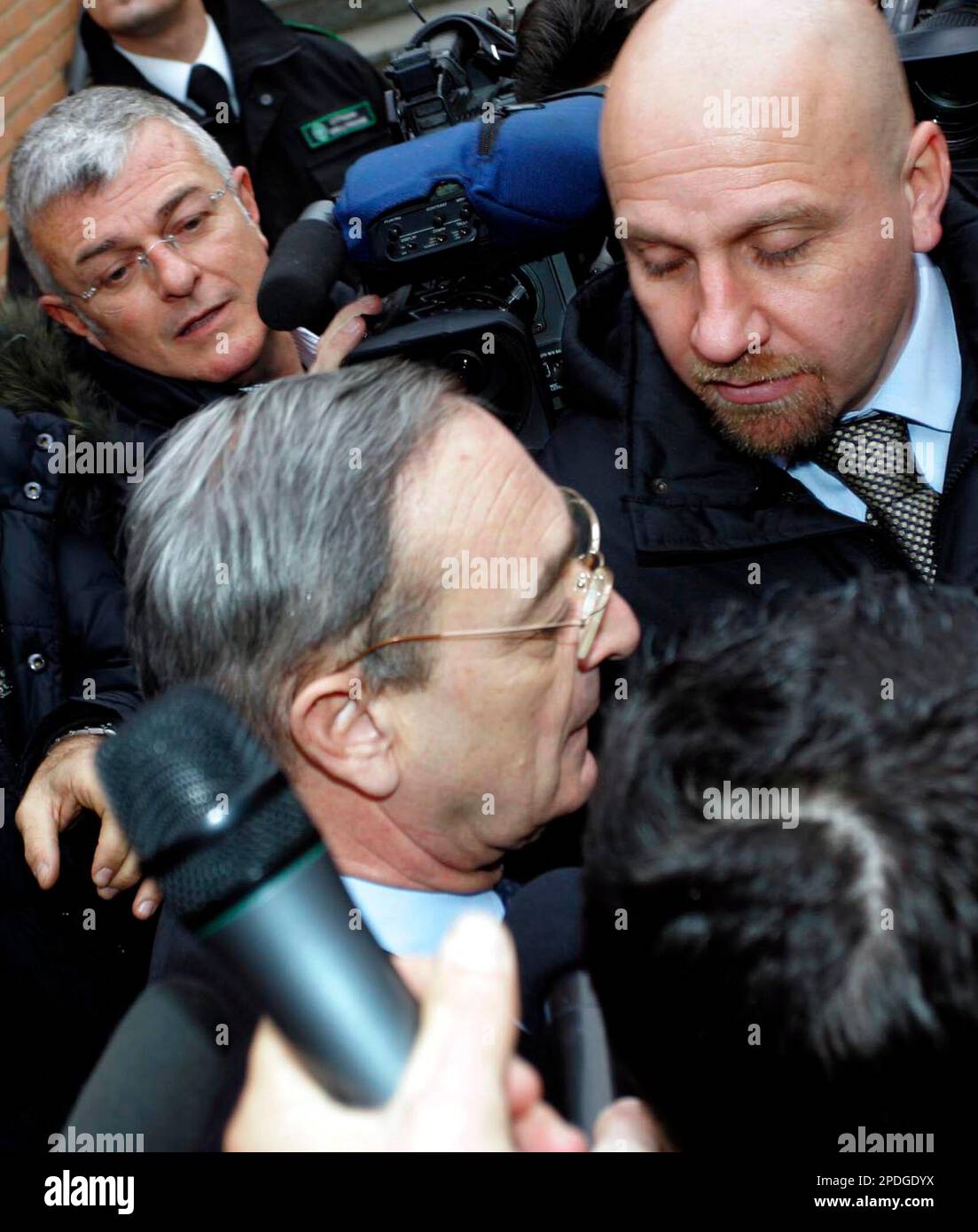 Lawyer Carlo Taormina answers journalist questions in Turin Monday, Dec. 19, 2005, while ...