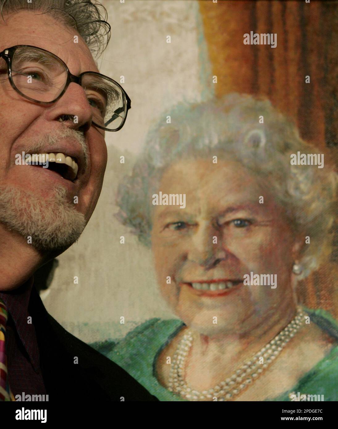 Artist Rolf Harris stands with his portrait of Britain's Queen ...