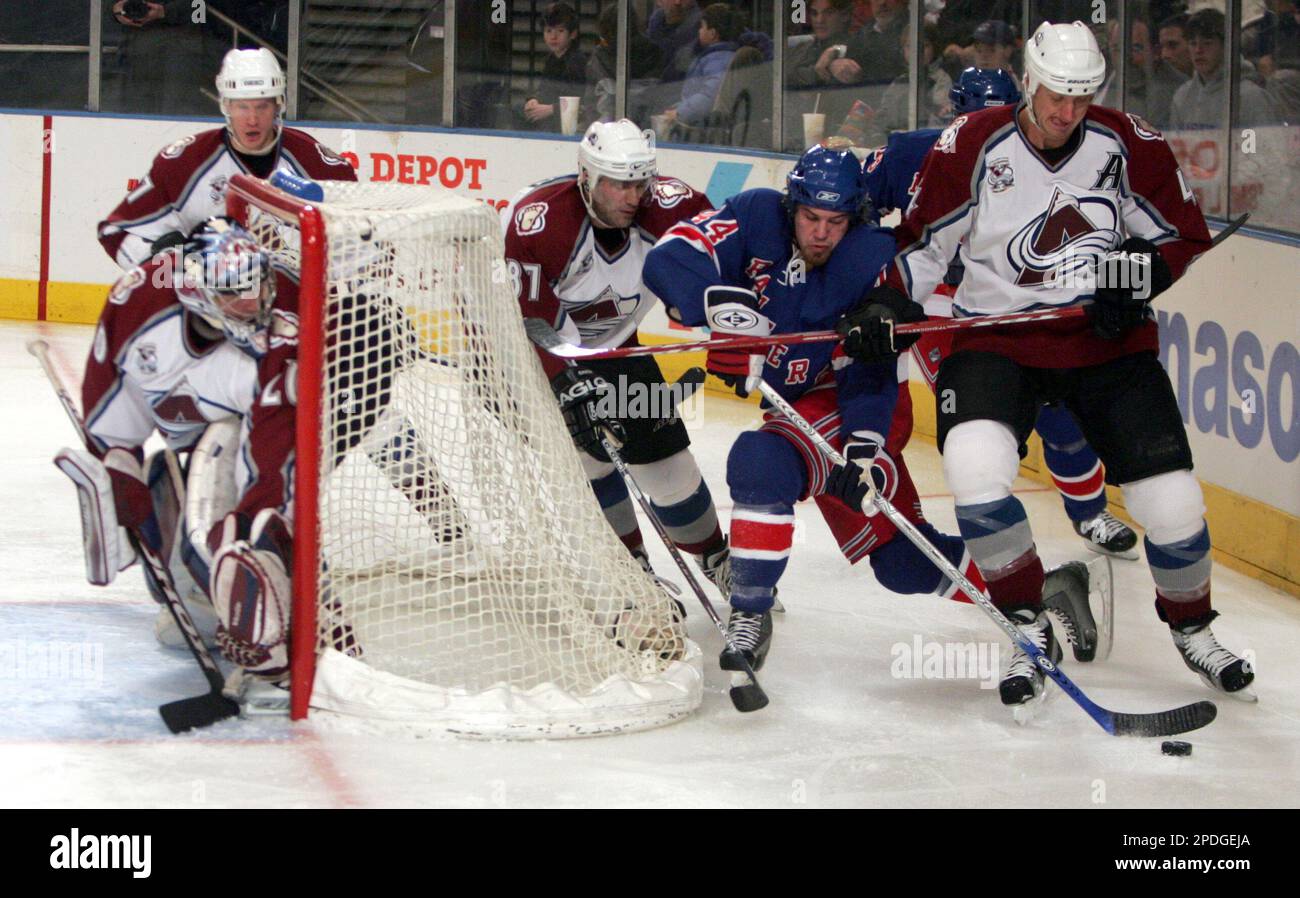 New York Rangers Ryan Hollweg battles for the puck against Colorado ...