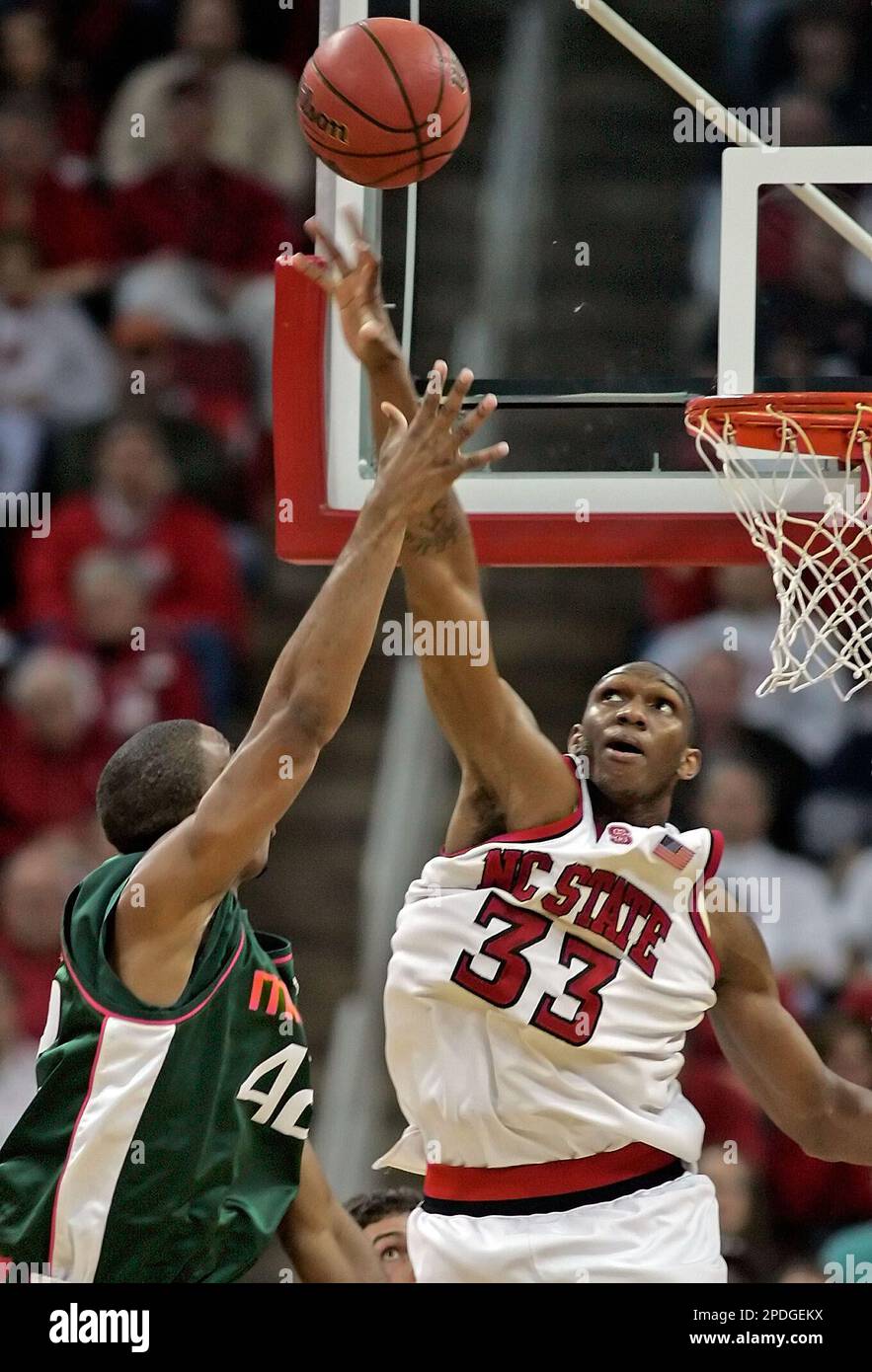 North Carolina State's Cedric Simmons (33) blocks the shot of Miami's ...