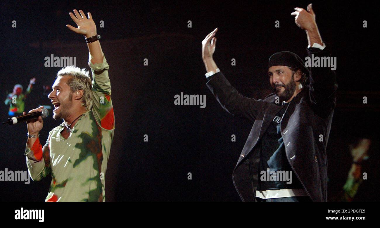 Dominican Republic singer Juan Luis Guerra, right sings in a duet with ...